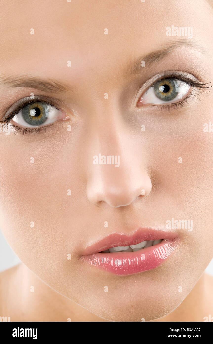 clse up on the face of a young and pretty woman with fair eyes Stock ...