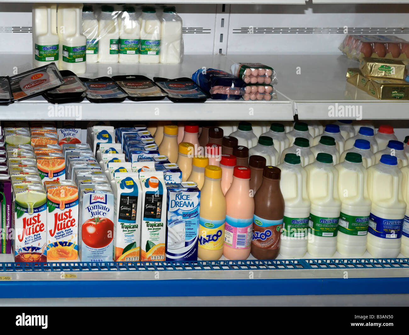 Shelf with eggs milk and soft drinks Stock Photo - Alamy