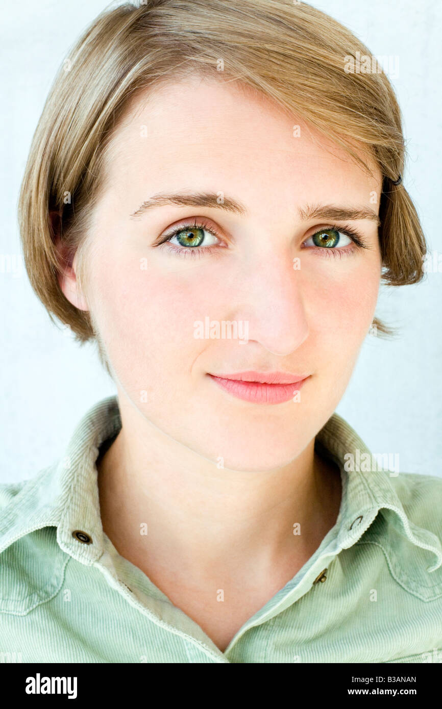 Attractive young woman with an ambiguous expression Stock Photo - Alamy