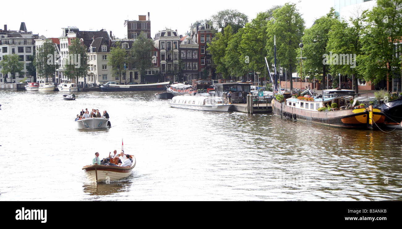 Boats on river in Amsterdam Stock Photo - Alamy