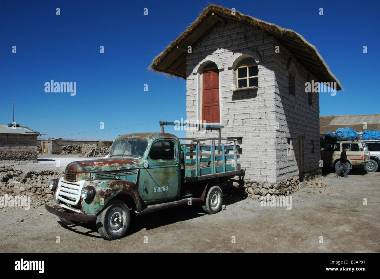 Salt house and old pick up in the village of Colchani, on the edge of ...