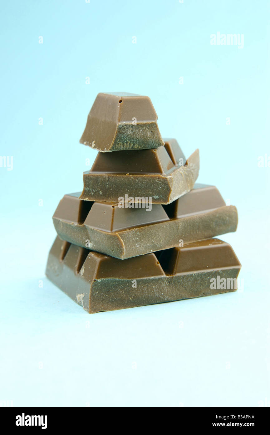 Chocolate isolated against a blue background Stock Photo - Alamy