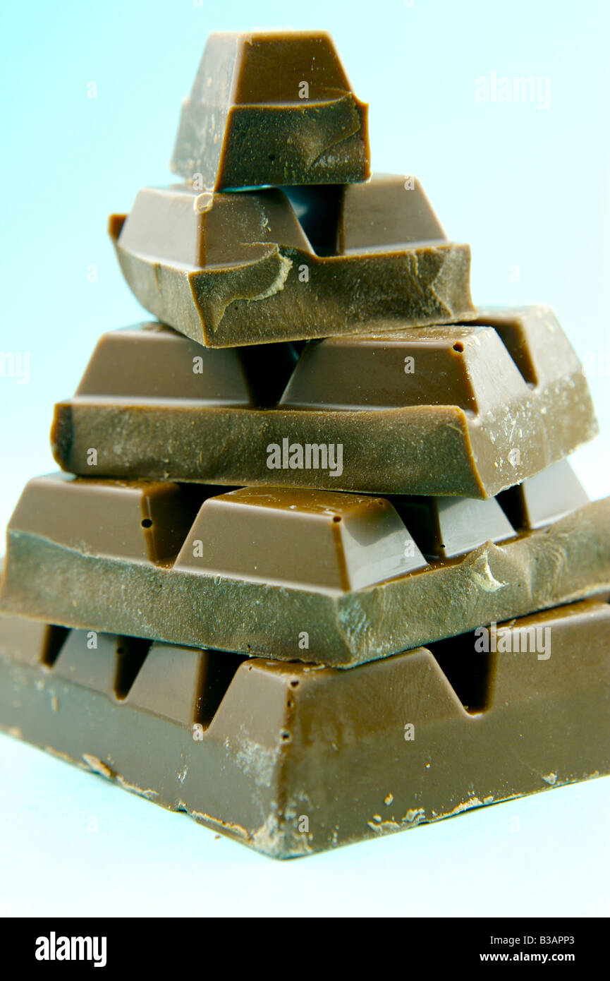 Chocolate isolated against a blue background Stock Photo - Alamy