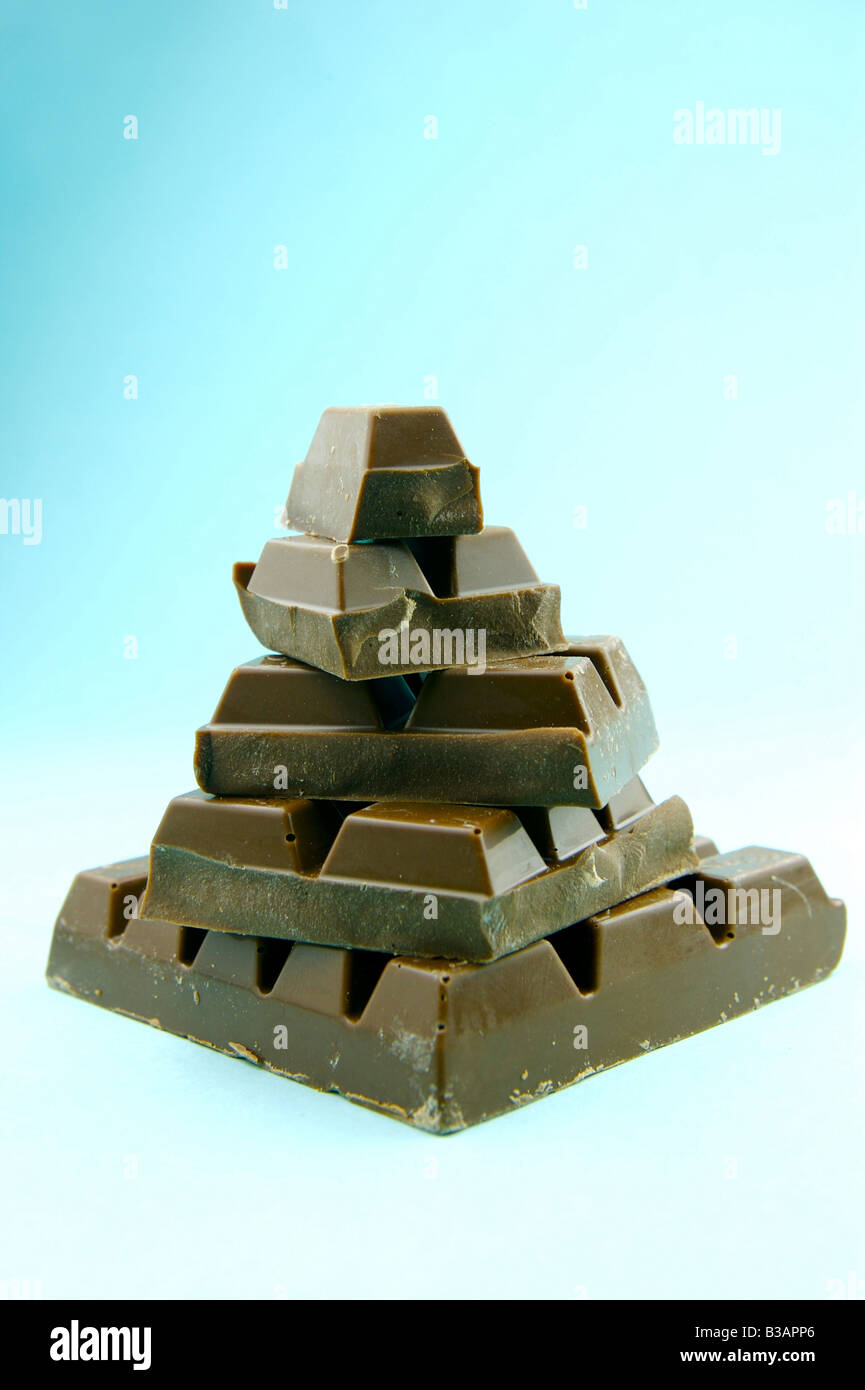 Chocolate isolated against a blue background Stock Photo - Alamy