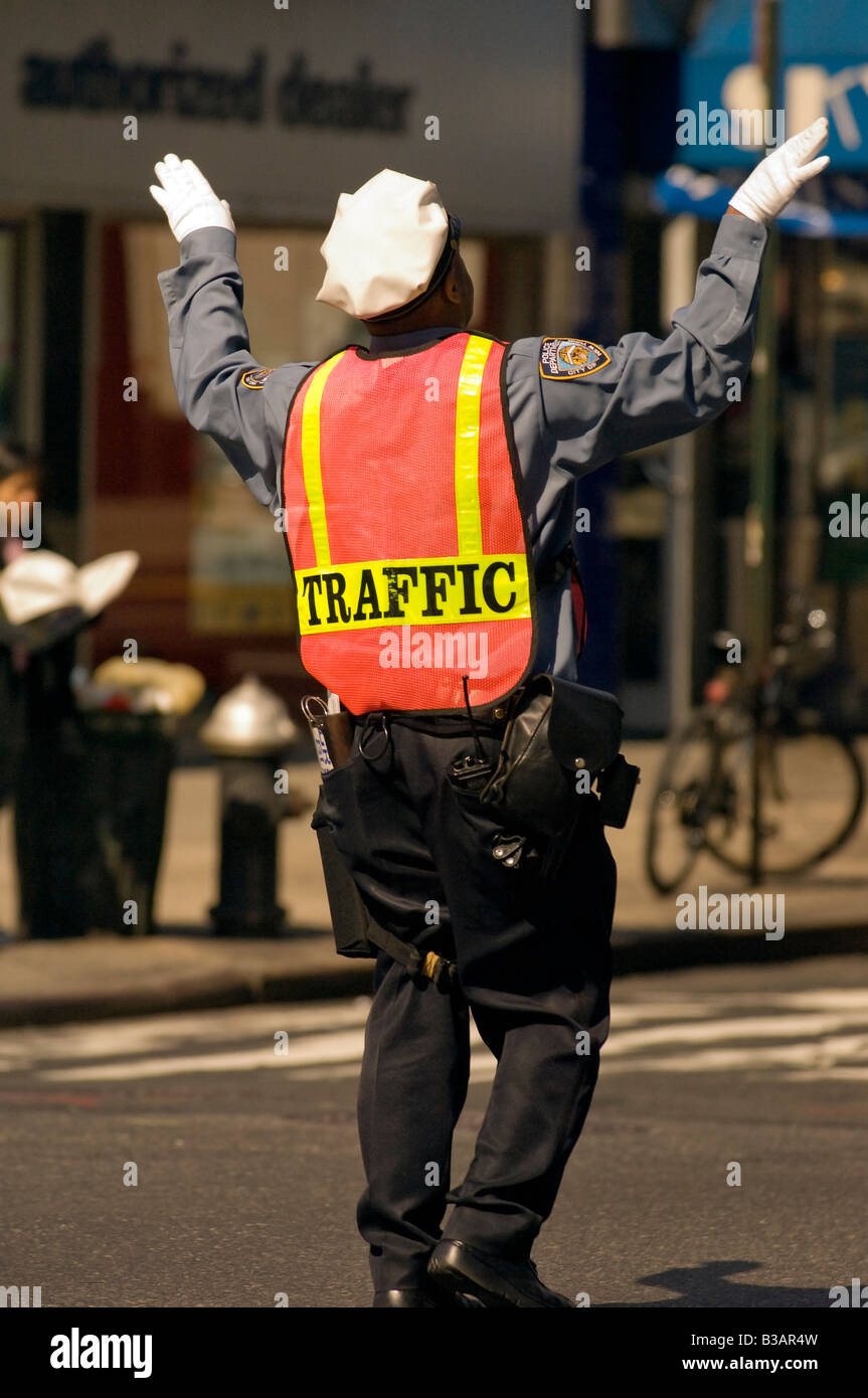 A traffic cop directing traffic in a New York City street Stock Photo ...