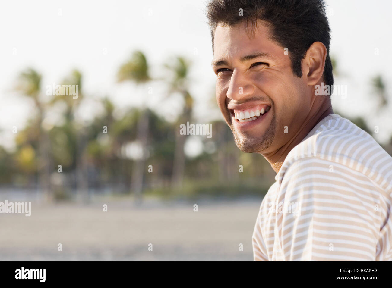 Hispanic man laughing Stock Photo - Alamy