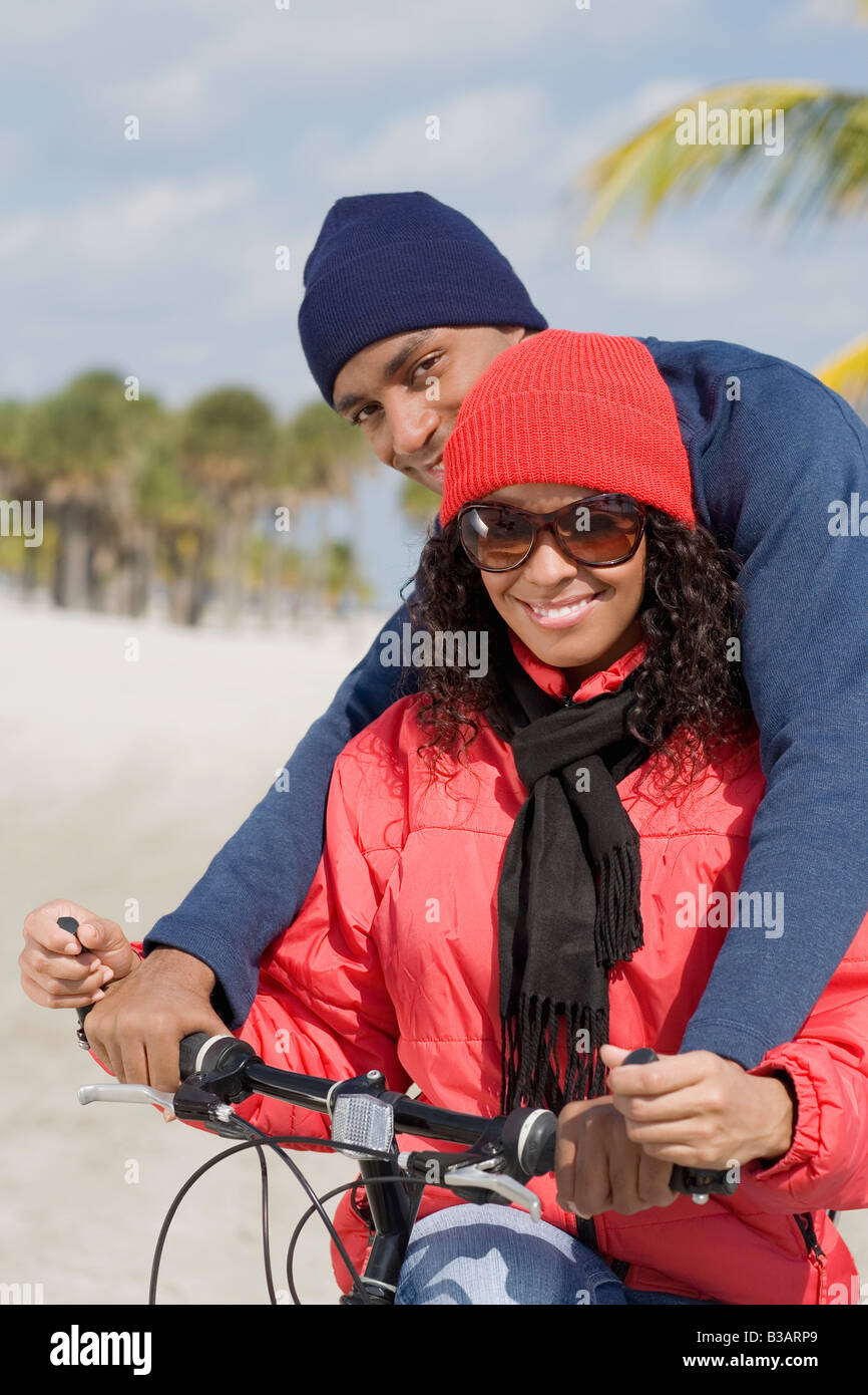 Hispanic man riding bike beach hi-res stock photography and images - Alamy