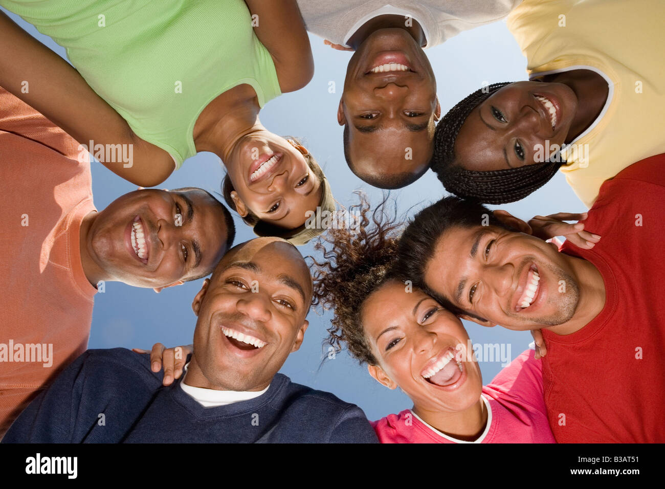 People huddle together in below hi-res stock photography and images - Alamy