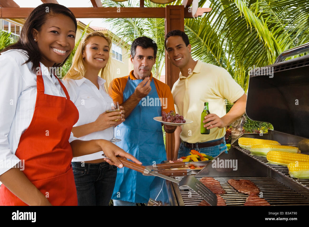 Group friends barbecuing backyard hi-res stock photography and images ...