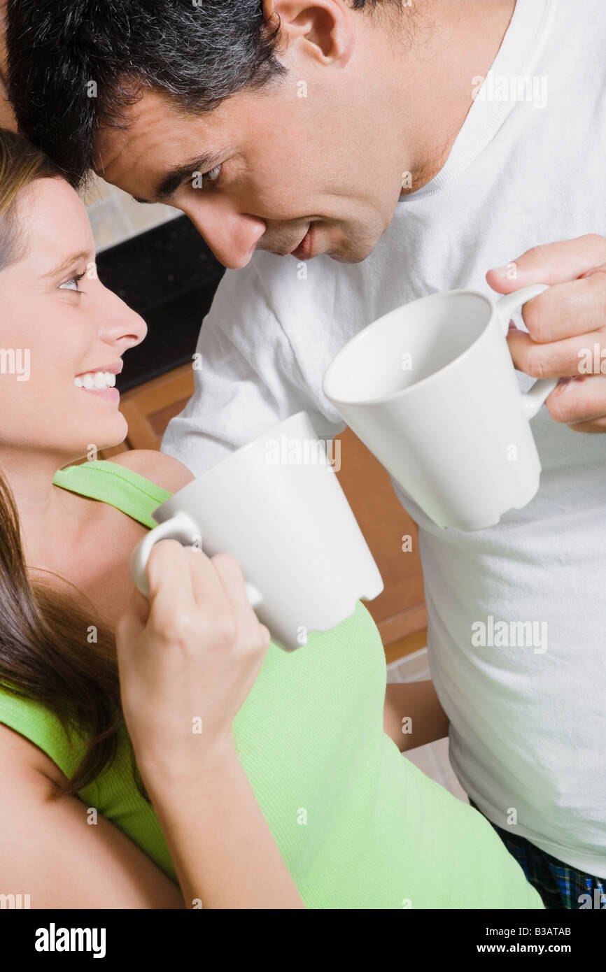 Hispanic couple drinking coffee Stock Photo - Alamy