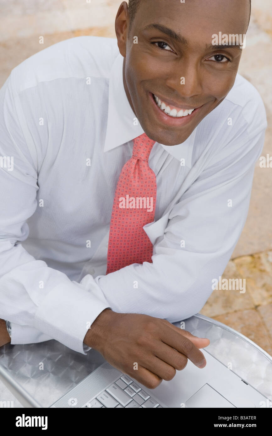Hispanic businessman next to laptop Stock Photo - Alamy