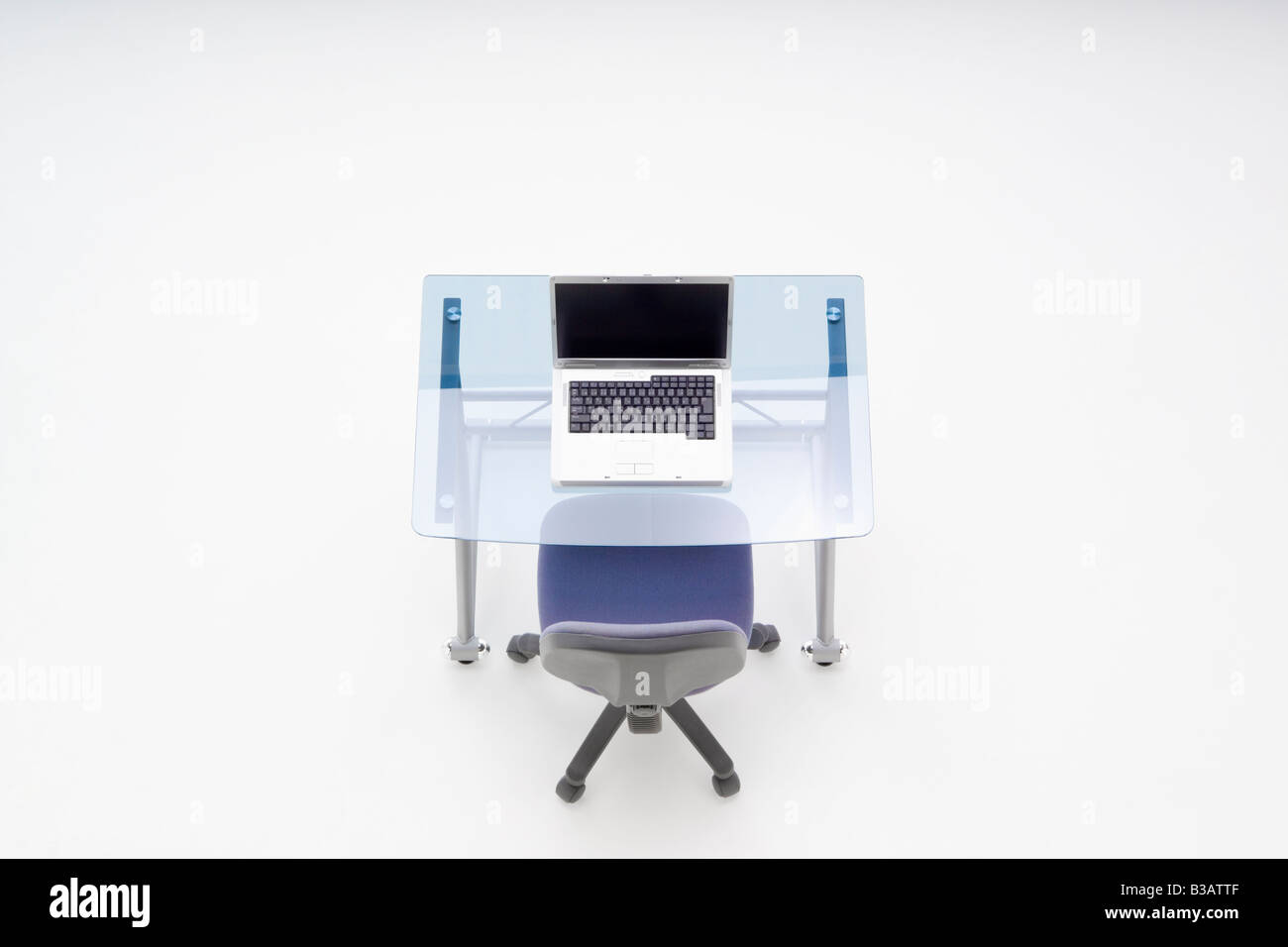 Laptop computer on desk and chair Stock Photo - Alamy