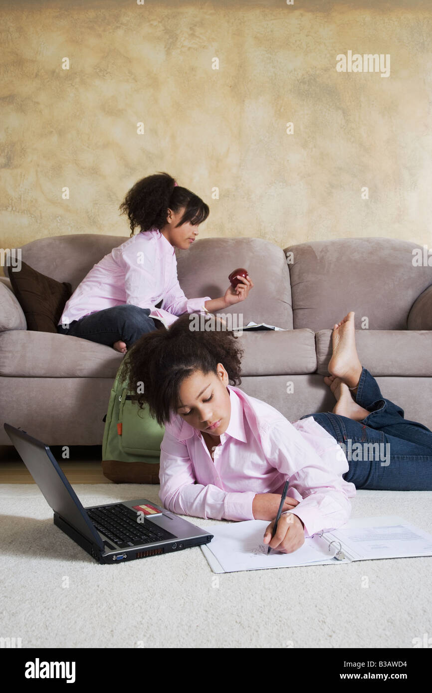 African twin sisters doing homework Stock Photo - Alamy