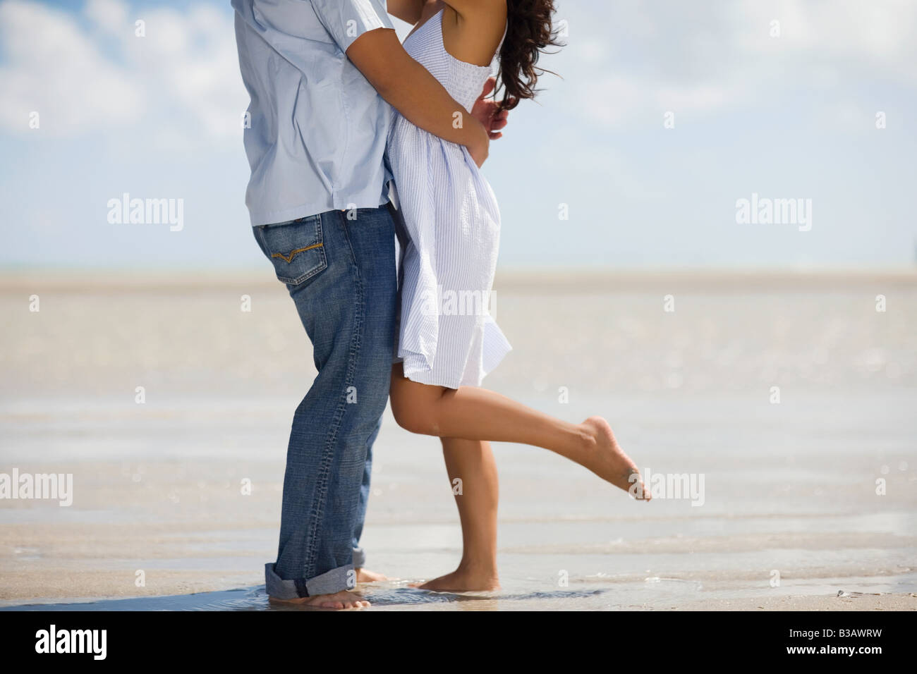 Hispanic couple hugging Stock Photo - Alamy