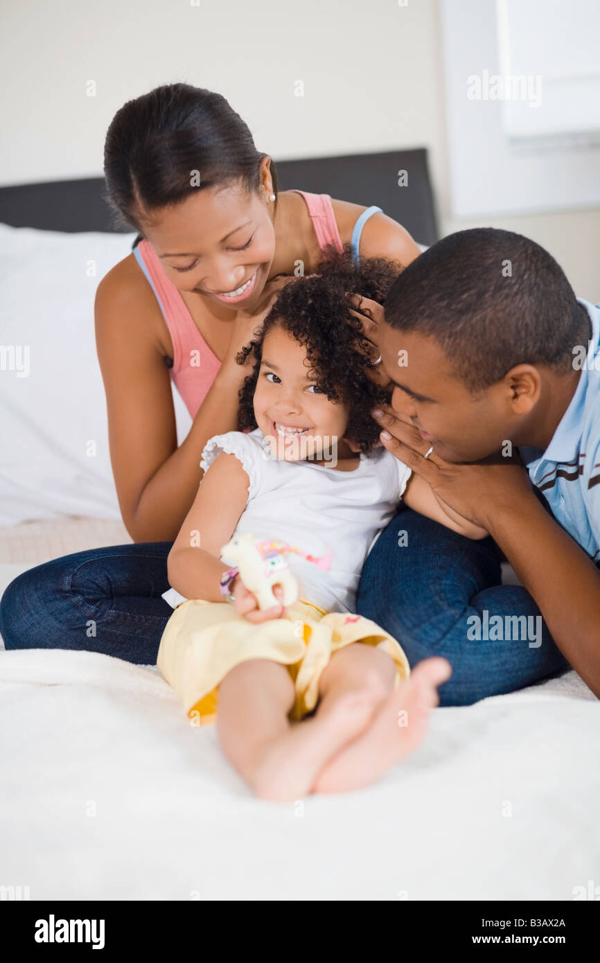 African parents smiling at daughter Stock Photo - Alamy