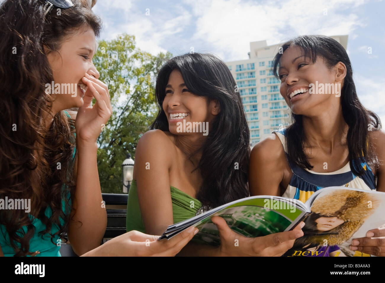 Hispanic women laughing Stock Photo - Alamy