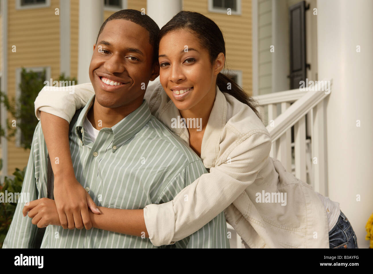 African couple hugging Stock Photo - Alamy