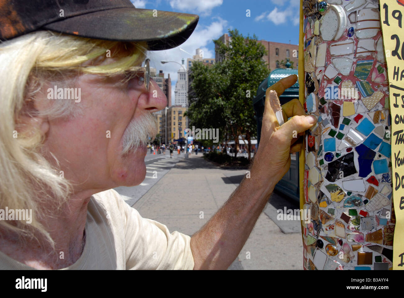 Mosaic Man Jim Power repairs one of his 80 lamp posts along the Mosaic ...