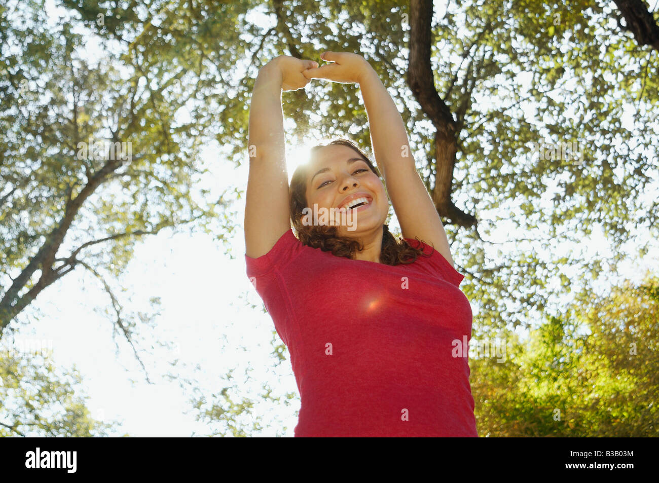 Woman stretching arms laughing hi-res stock photography and images - Alamy