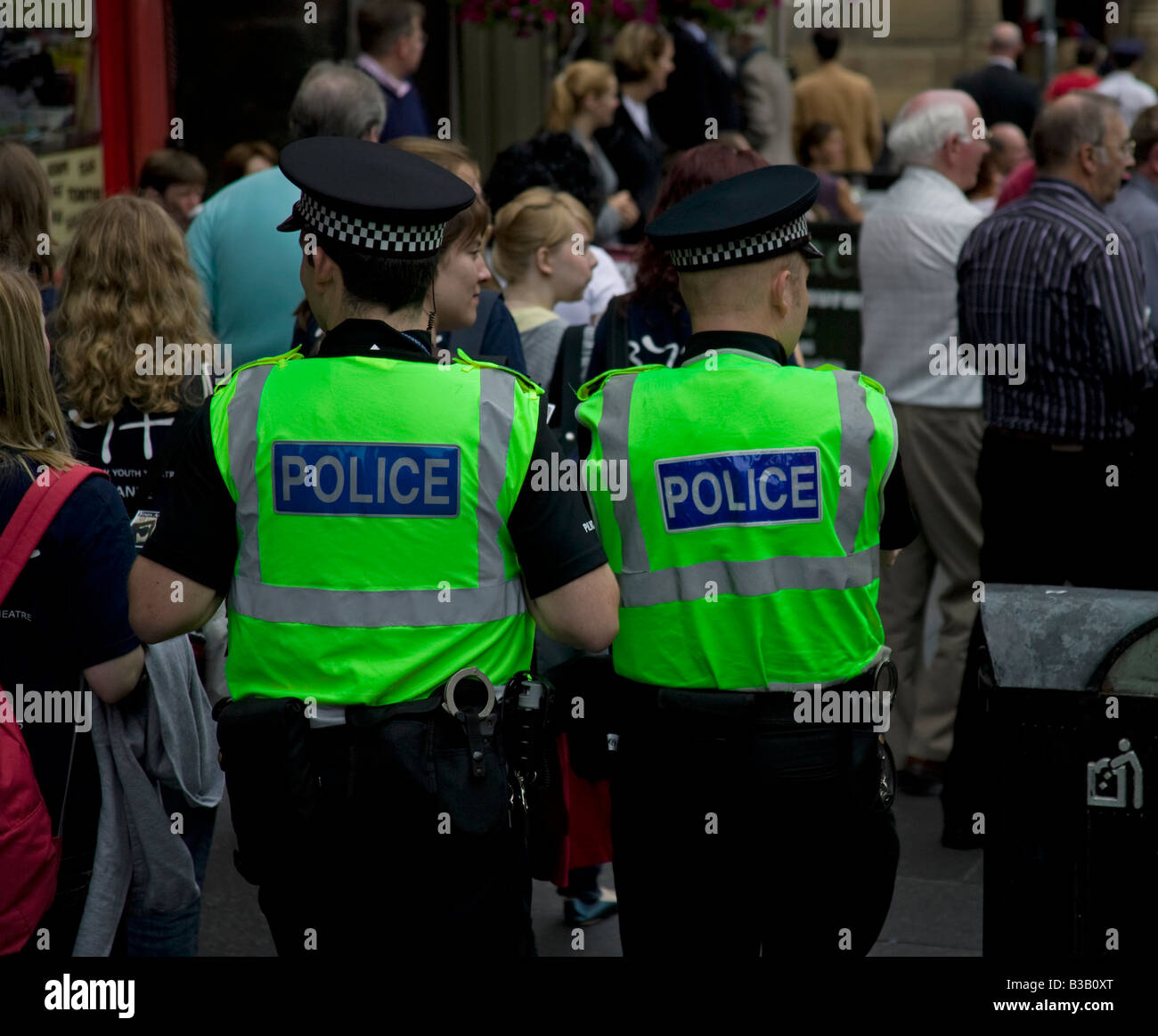 Two male Police officer patrol busy High Street, Royal Mile, Edinburgh ...