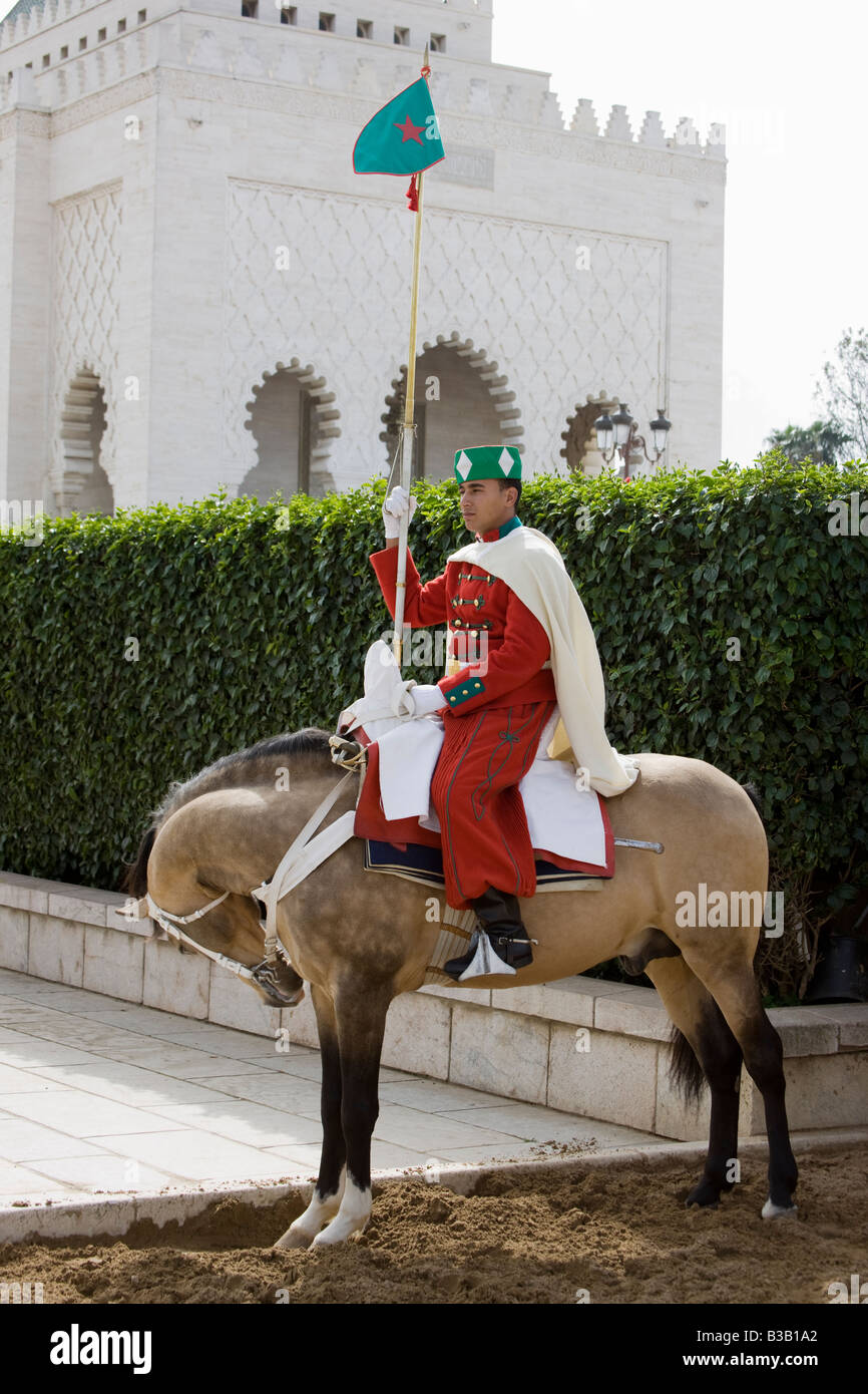 A royal guard stands at the entrance to the Mausoleum of Mohammed V in ...