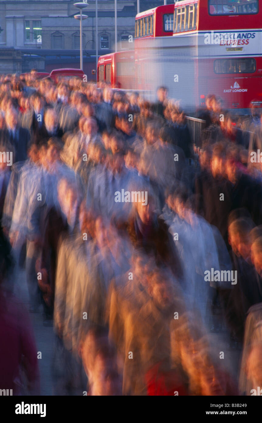 people on the way to work, commuters on London Bridge, London, England ...