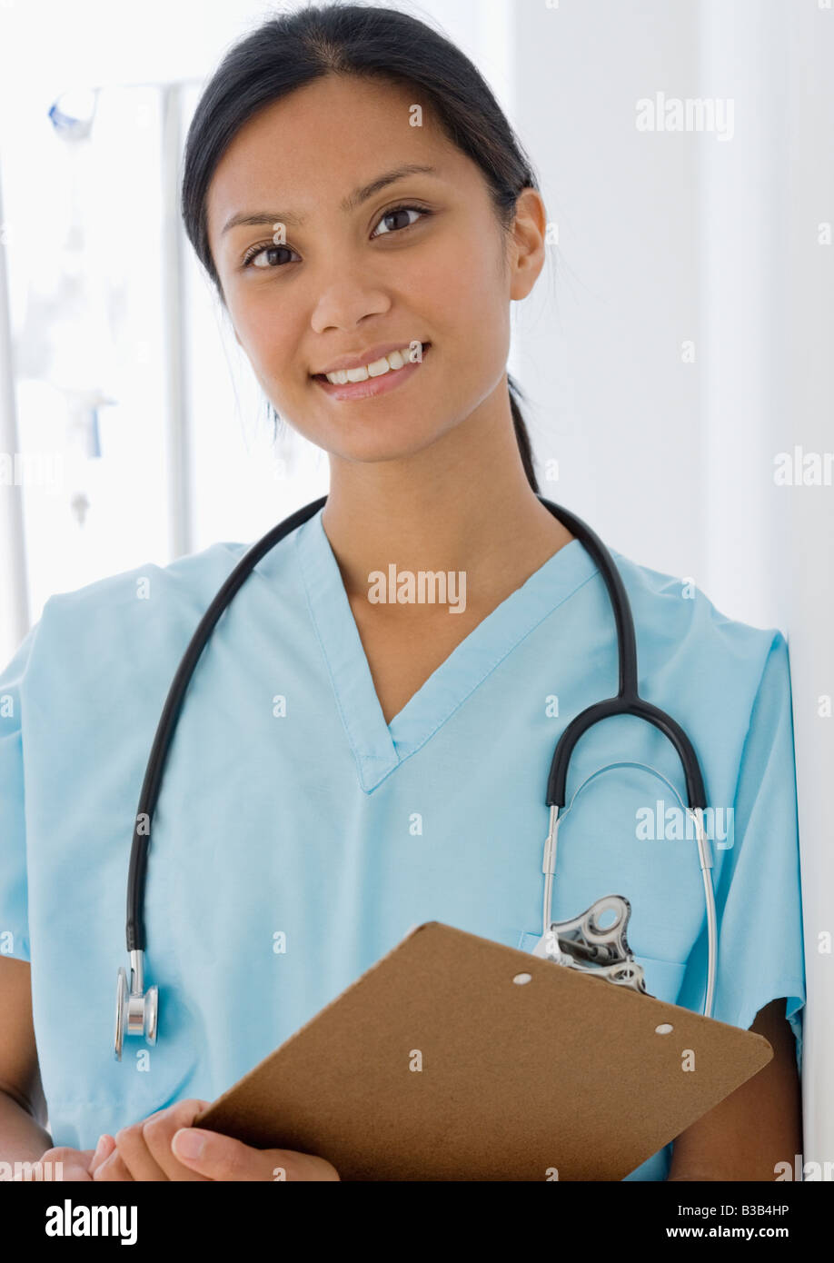 Pacific Islander female doctor holding chart Stock Photo - Alamy