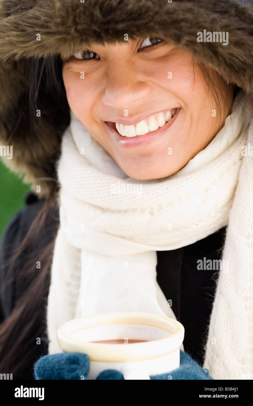 Pacific Islander woman drinking hot chocolate Stock Photo - Alamy