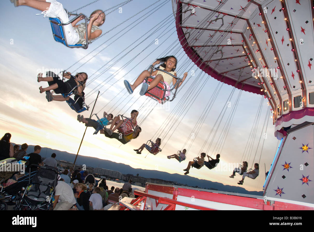 Children on a fair ground ride Stock Photo - Alamy