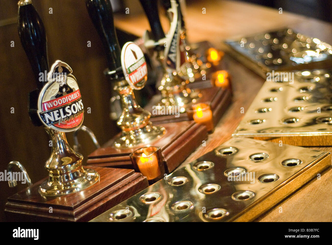 close up detail of a bar in a traditional english country pub in the uk ...