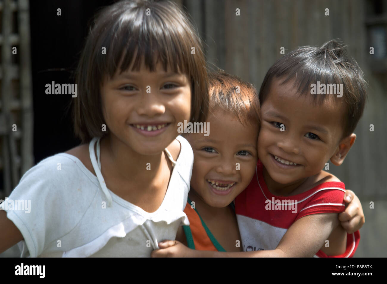 Happy smiling Filipino children at Barili on the west coast of Cebu ...