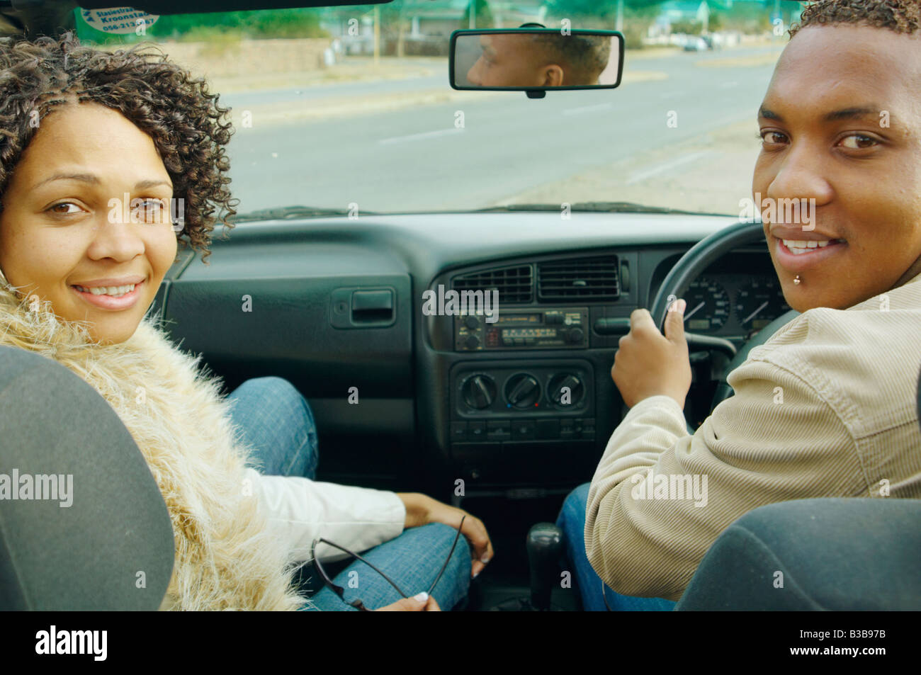 African couple driving in convertible car Stock Photo - Alamy