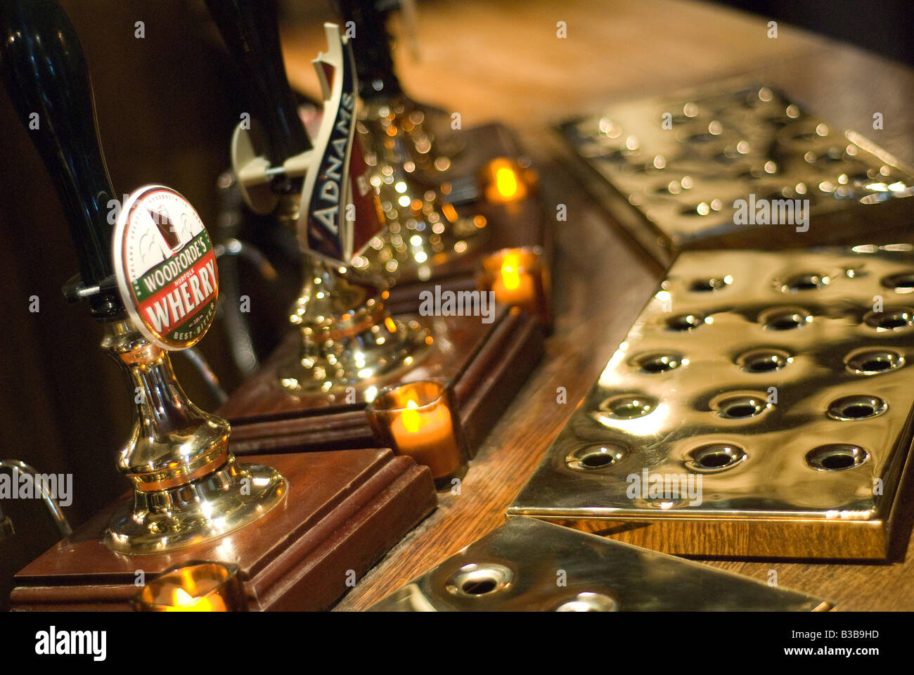 close up detail of a bar in a traditional english country pub in the uk ...