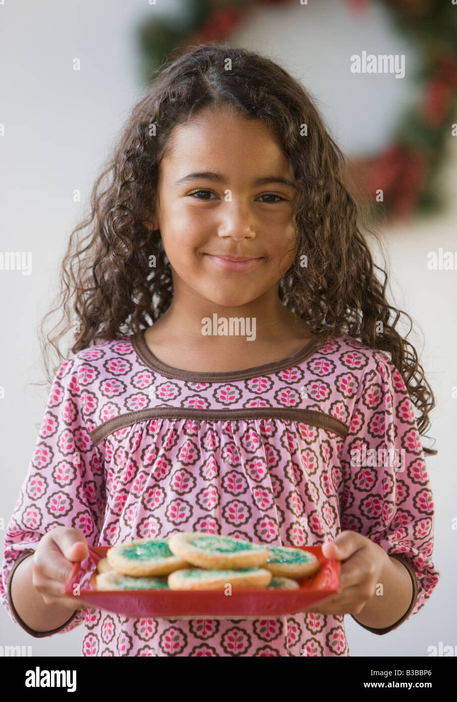 African girl holding plate of cookies Stock Photo - Alamy