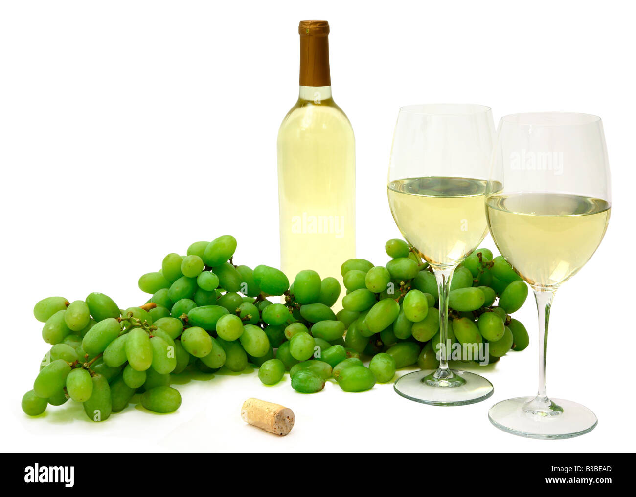 Green grapes, a bottle and a two glasses of white wine Stock Photo - Alamy