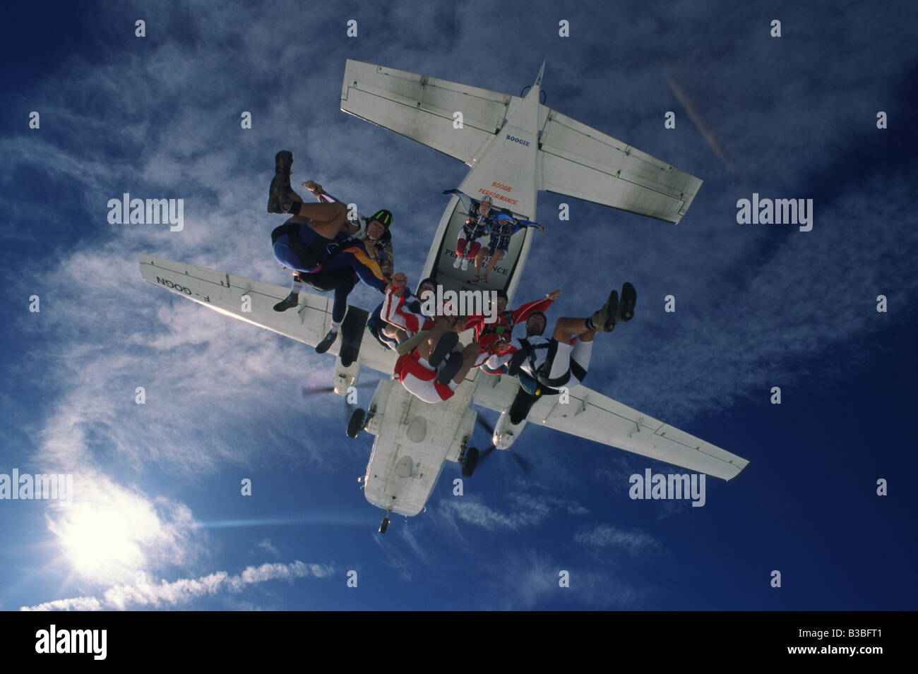 A group of Skydivers exit a Skyvan through its tailgat in a sitting ...