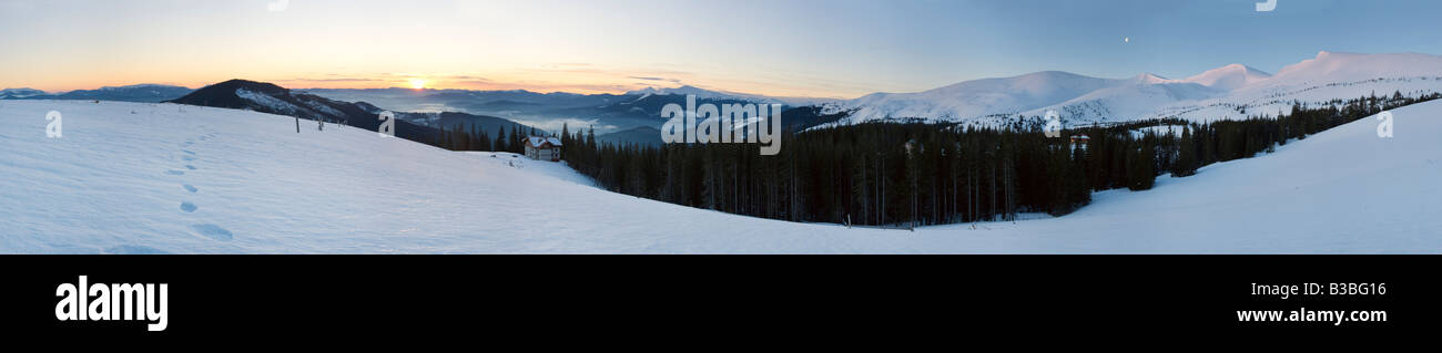 Mountain ridge sunrise panorama view with moon and sun Stock Photo - Alamy