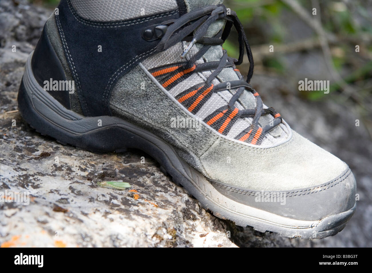 alpine boots on a rock Stock Photo - Alamy