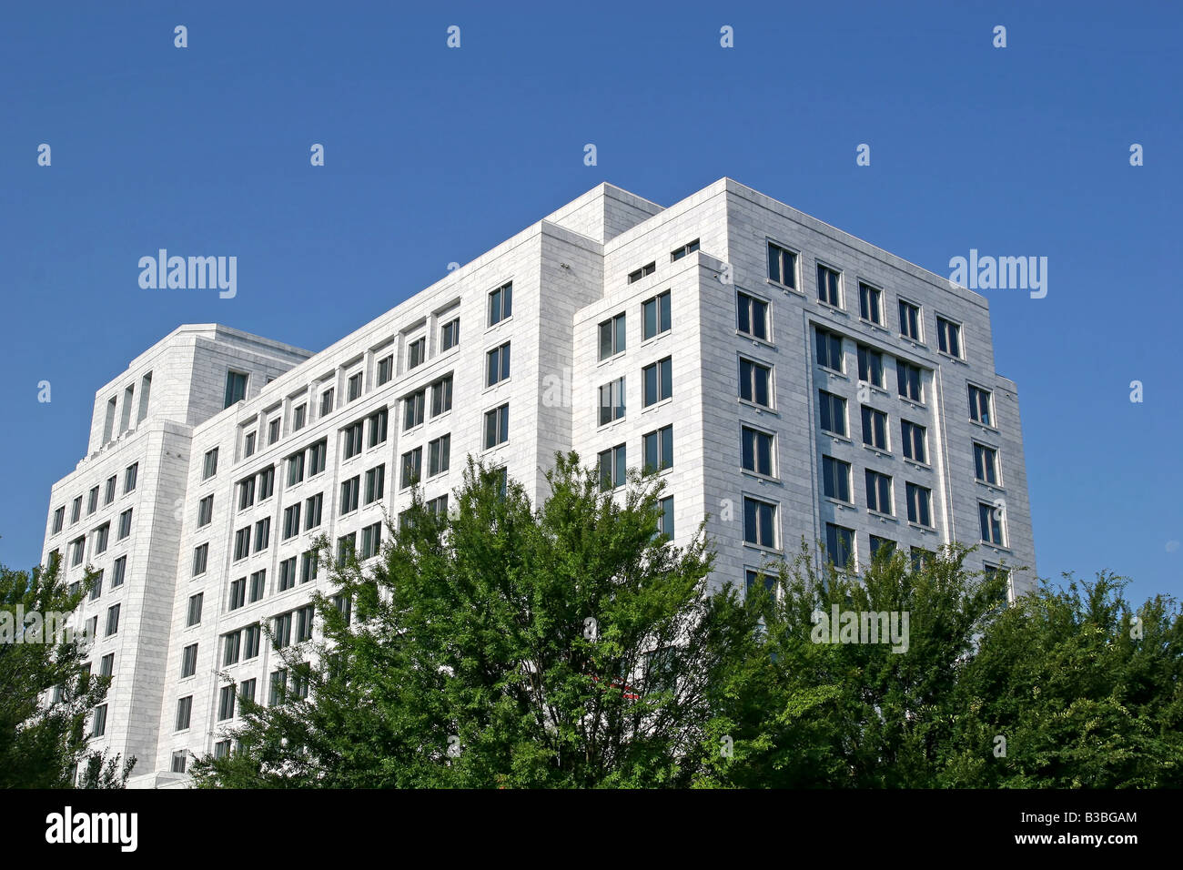 A white marble government building rising into a blue sky Stock Photo ...