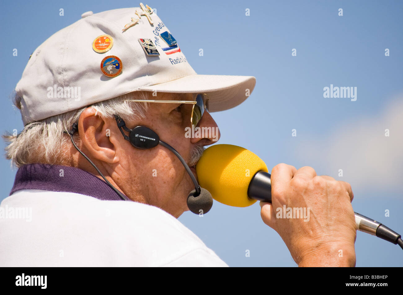 Announcer using microphone and headset Stock Photo - Alamy