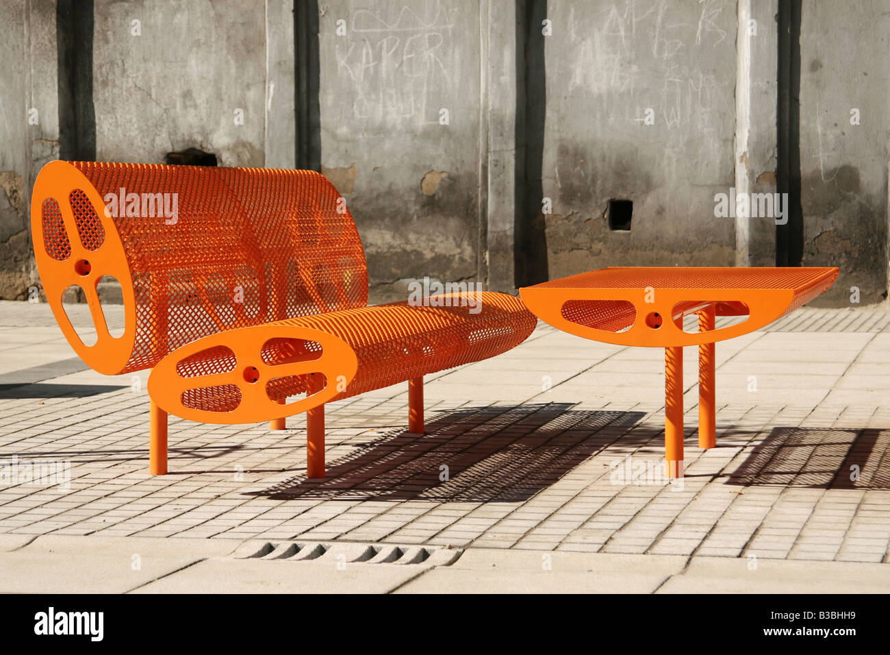 Modern orange bench at the city sidewalk Stock Photo - Alamy