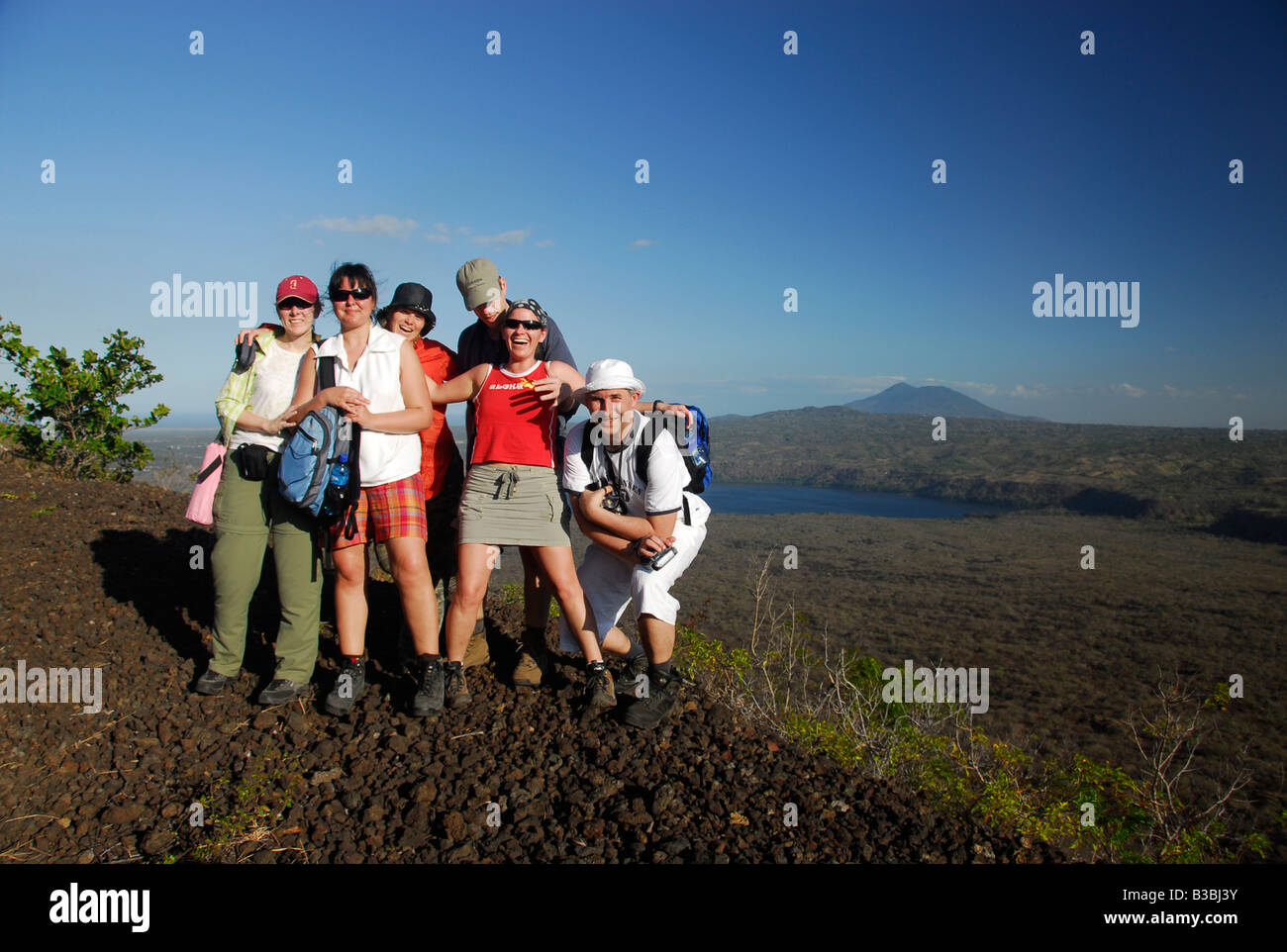 Visitors in the Masaya Volcano National Park with Mombacho Volcano in ...