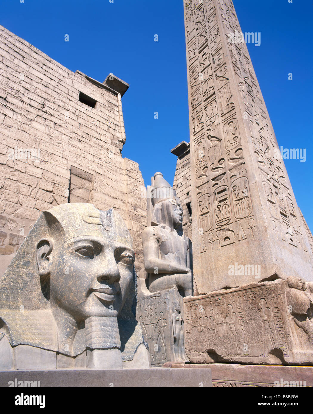 Egypt, Luxor, East Bank, Luxor Temple, statues of Ramses II and obelisk ...