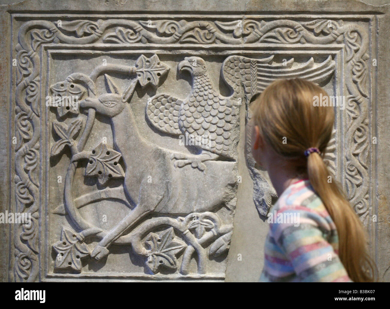 Young visitor looking at a Byzantine relief from the Byzantine ...