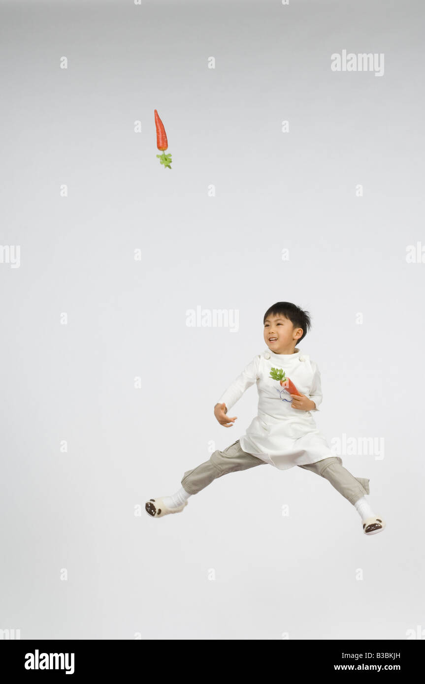 Boy throwing carrot hi-res stock photography and images - Alamy