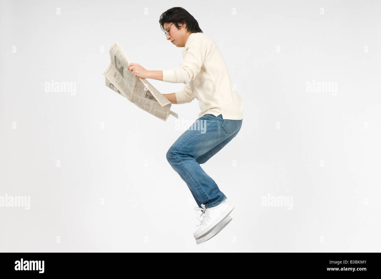 Man reading newspaper Stock Photo - Alamy