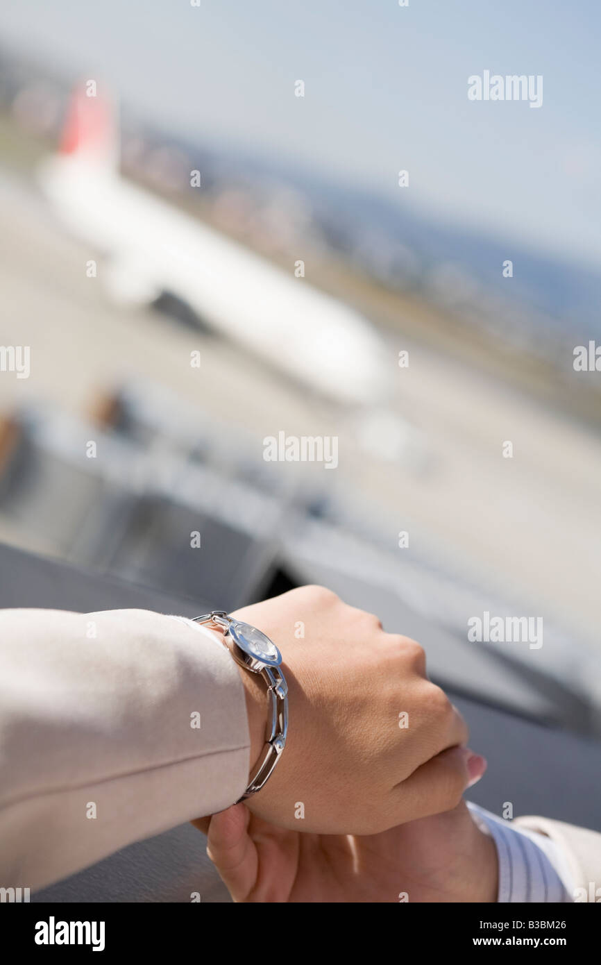 Woman wearing wristwatch hi-res stock photography and images - Alamy