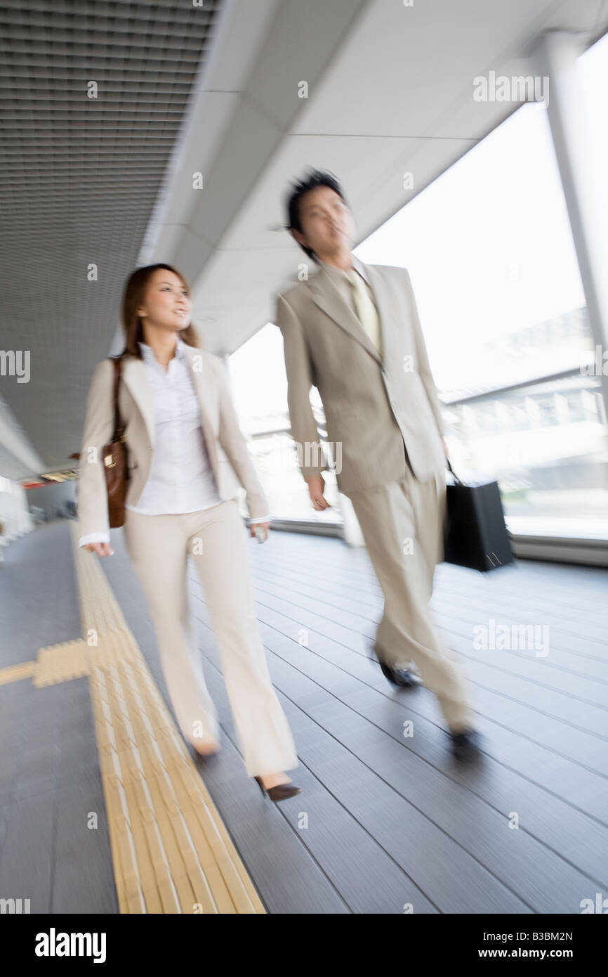 Business people walking, blurred motion Stock Photo - Alamy