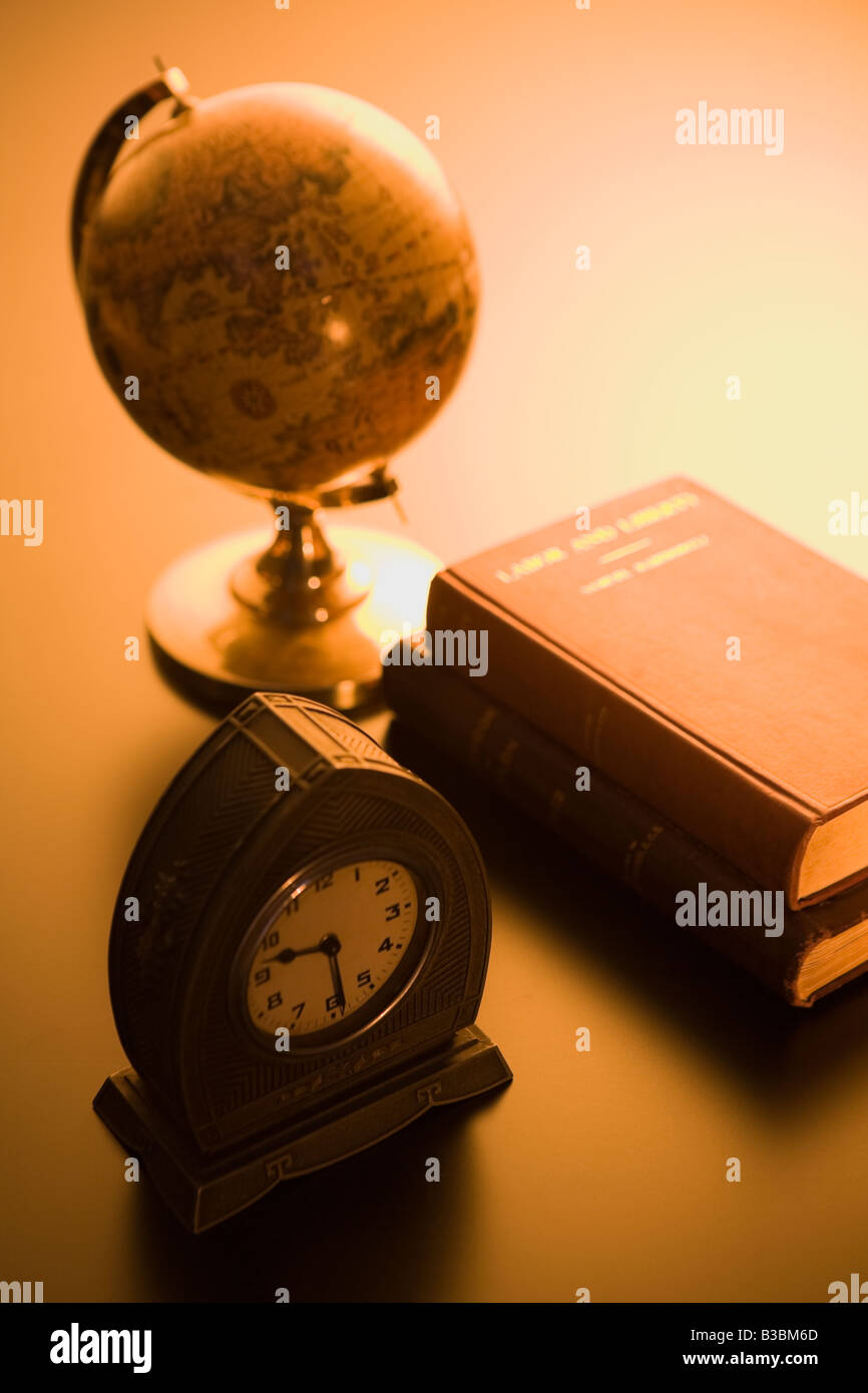 Globe, books and clock Stock Photo - Alamy