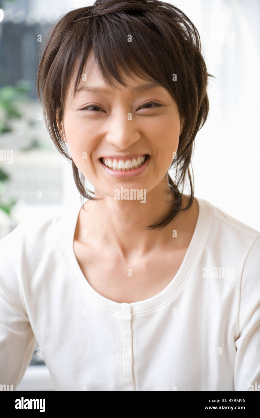 Portrait of smiling woman Stock Photo - Alamy